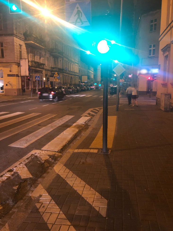 ambiXes Street corner, night, traffic, several car passes, people ...